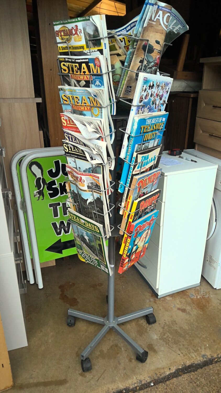 rotating magazine rack on wheels » Junk Skunk
